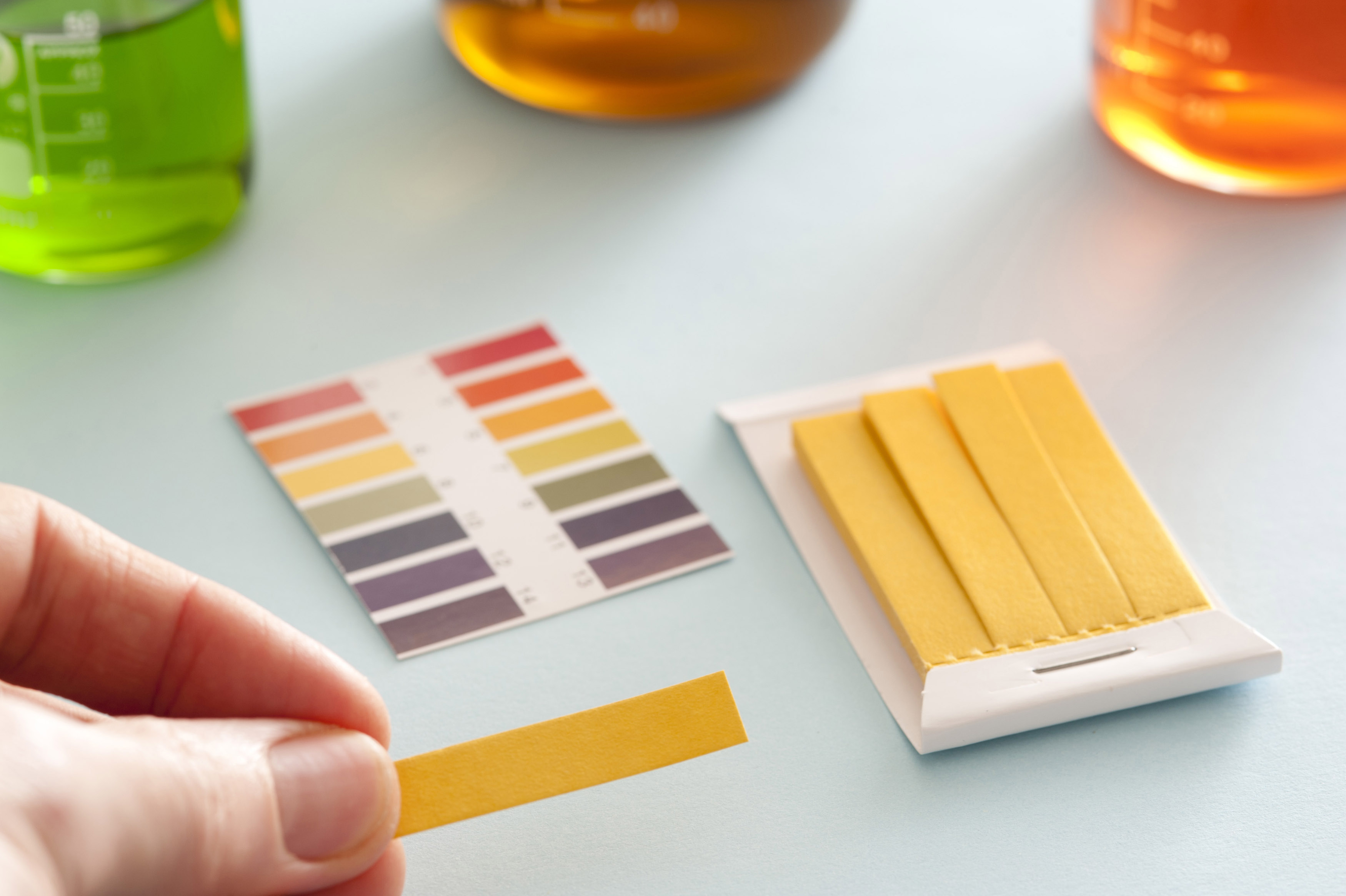 Free Stock Image Of Chemist Holding A PH Strip Of Litmus Paper Free Stock Image Of Chemist Holding A PH Strip Of Litmus Paper